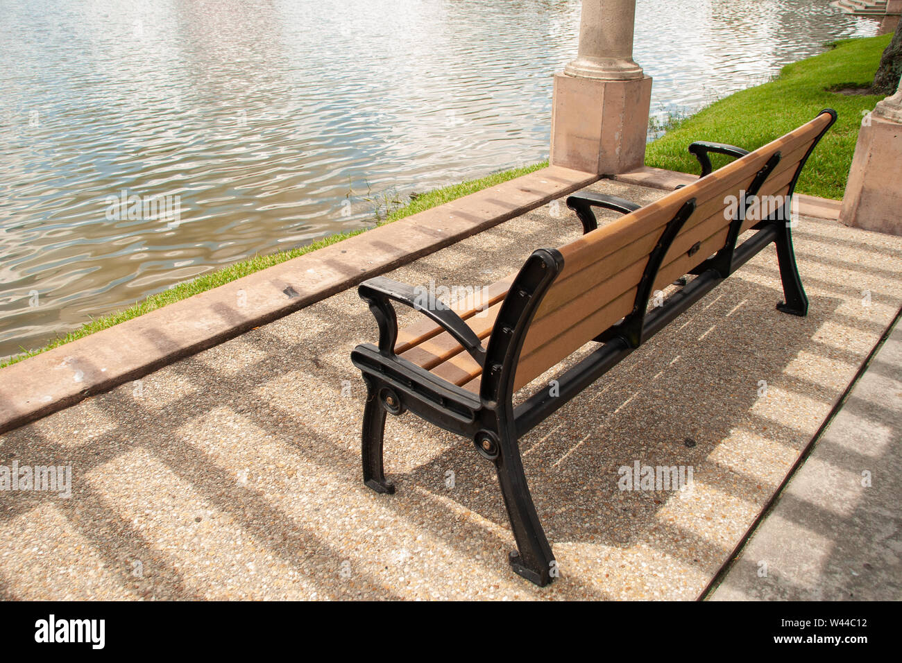 Park bench looking at a lake Stock Photo - Alamy