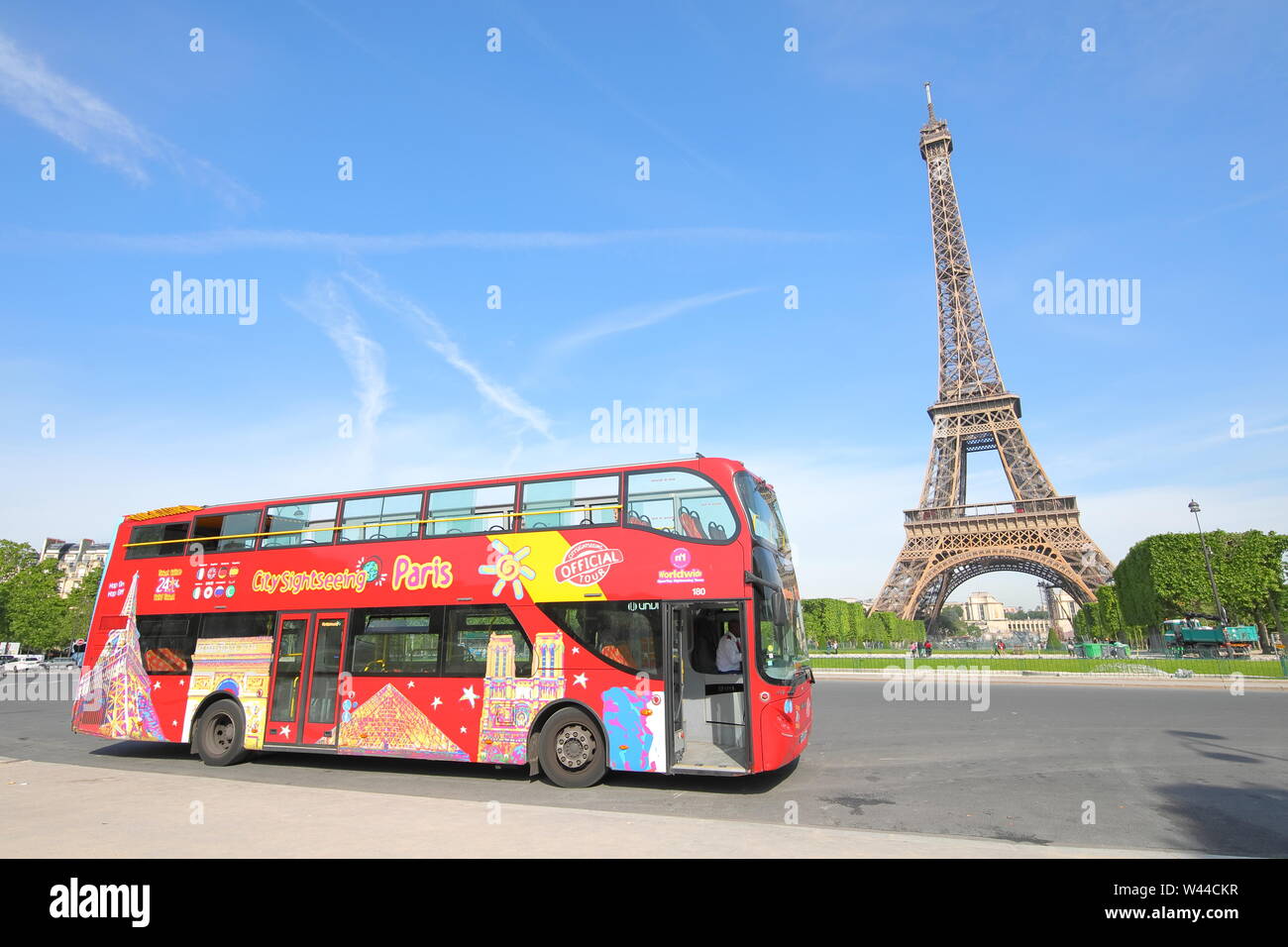 Double decker tourist bus parked in front of Eiffel tower Paris France ...