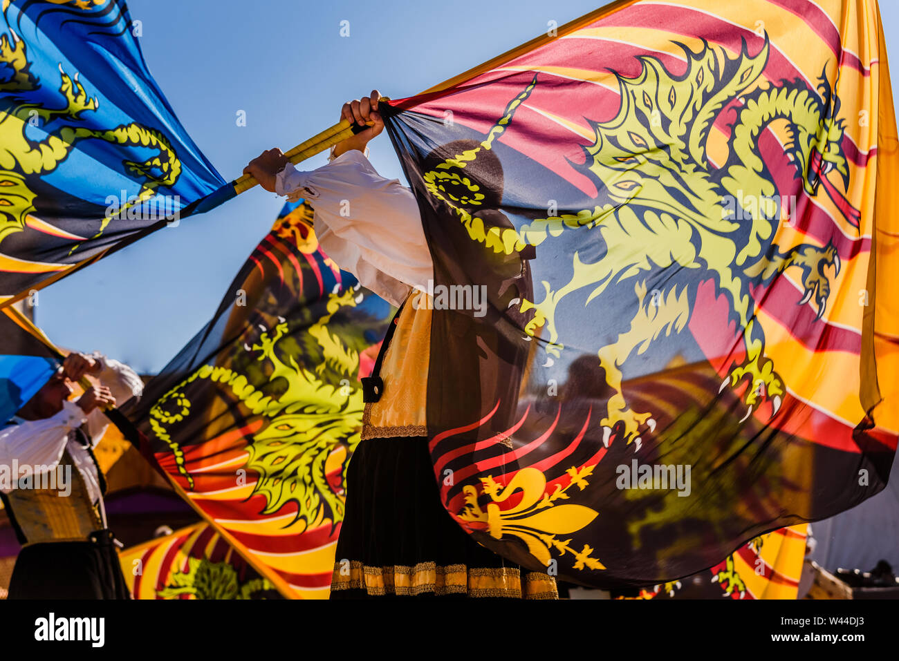 Traditional Italian dance of the flag-wavers Sbandieratori doing stunts ...