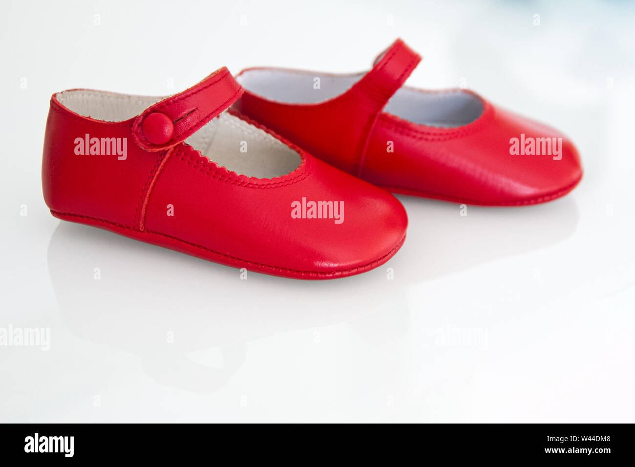 Pair of red children's shoes isolated on white background Stock Photo ...