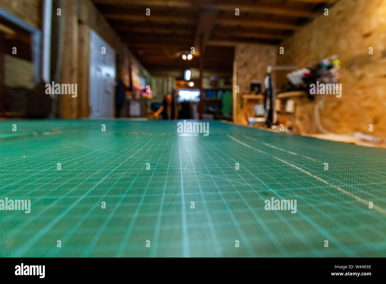 A closeup view on the green grid cutting surface on a technical drawing ...