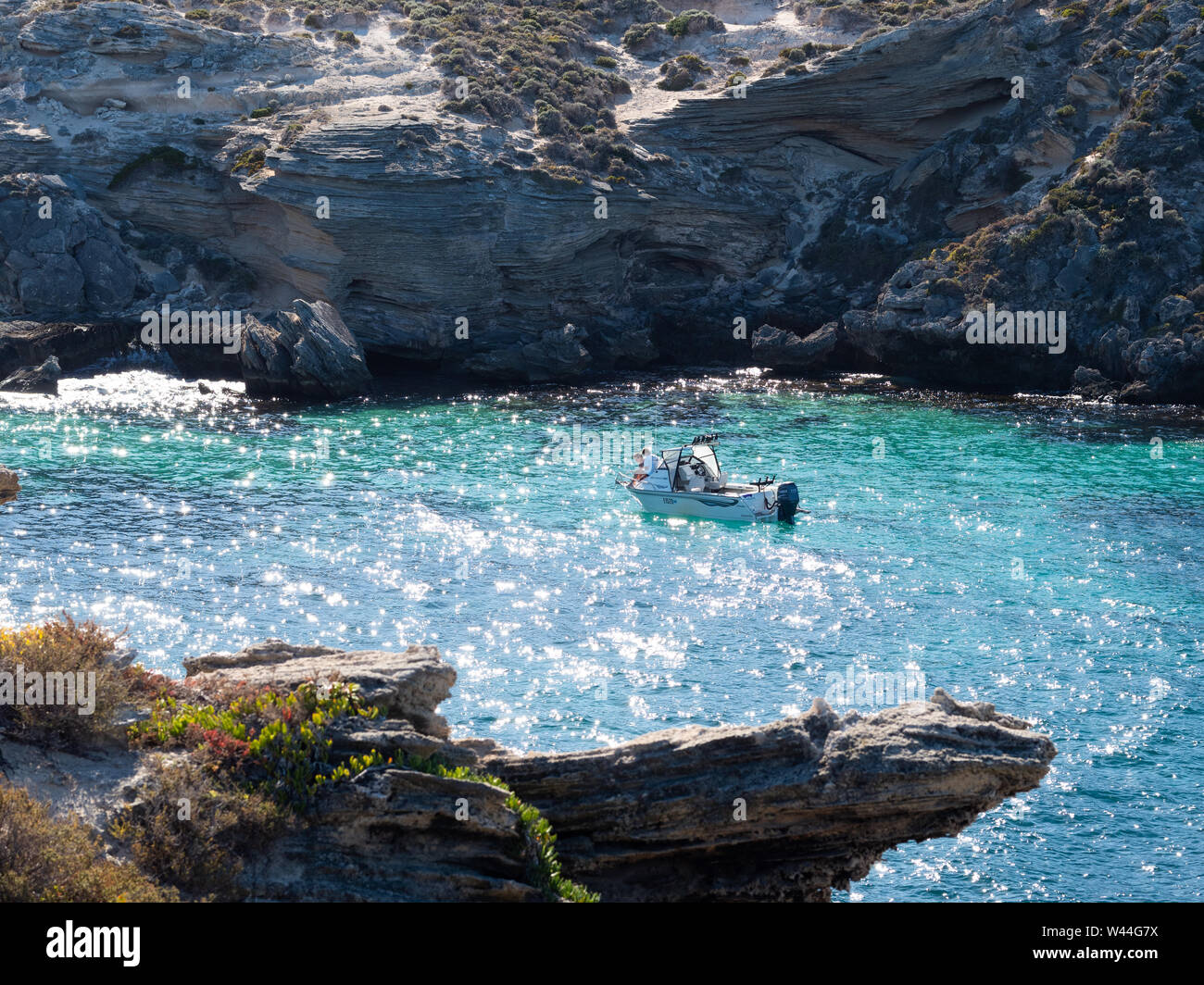 Boat in crystal clear water, Rottnest Island Stock Photo - Alamy