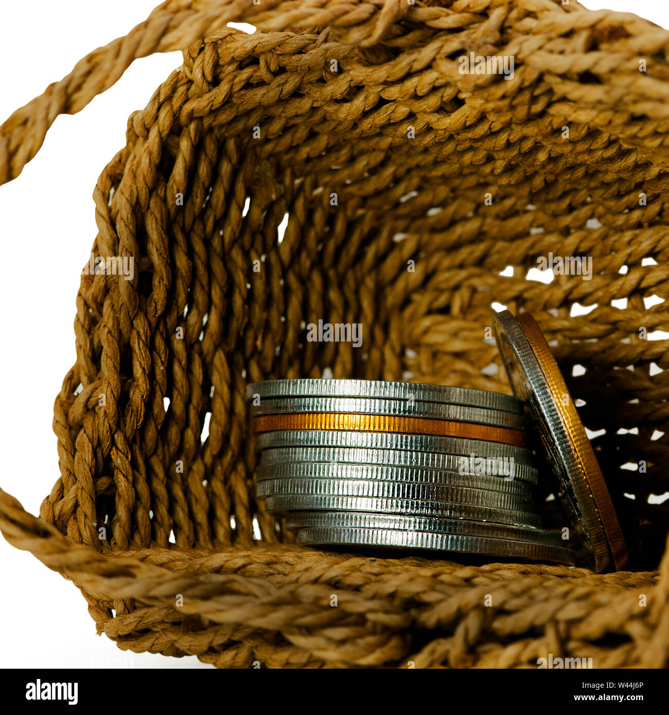 Gold and Silver Coins in a Small Basket Stock Photo - Alamy