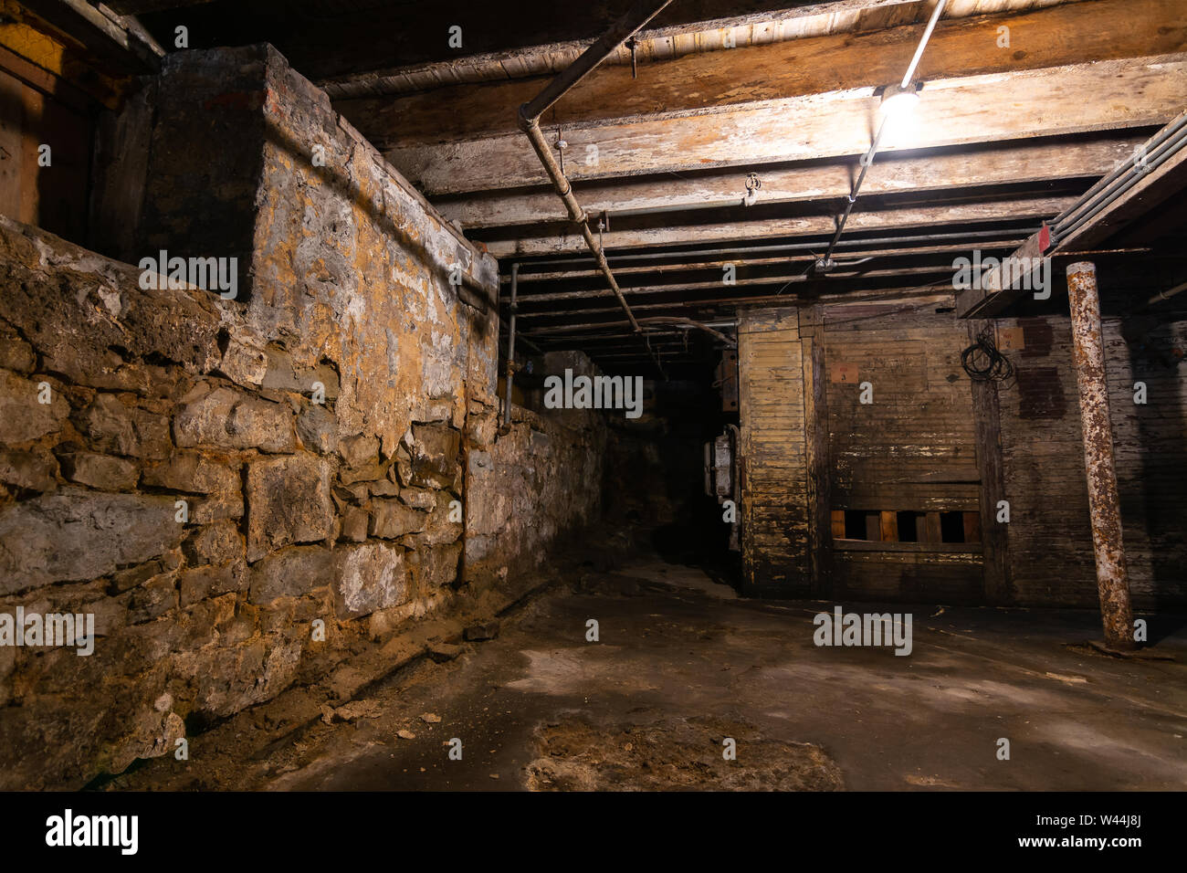 Interior of old grungy warehouse basement Stock Photo - Alamy