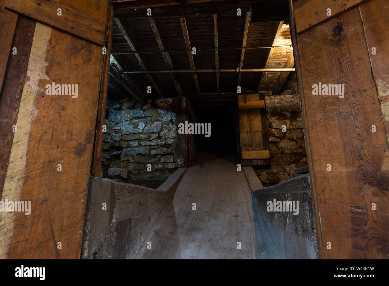 Old concrete loading chute in warehouse basement Stock Photo - Alamy