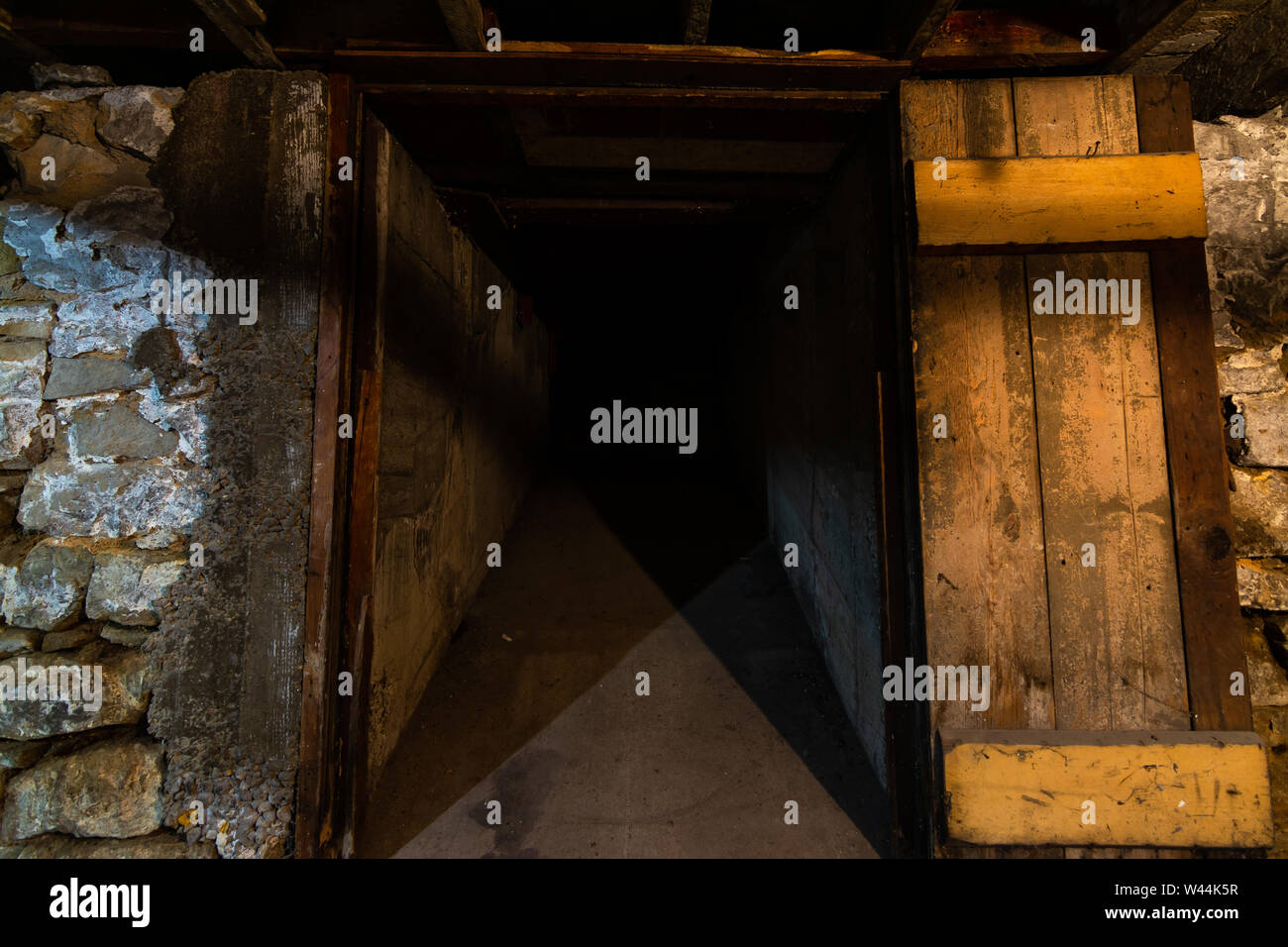 Old concrete loading chute in warehouse basement Stock Photo - Alamy