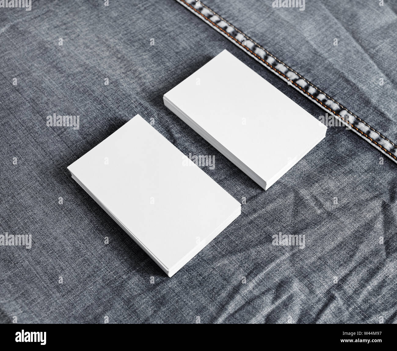 Blank name cards on gray denim background. White business cards ...