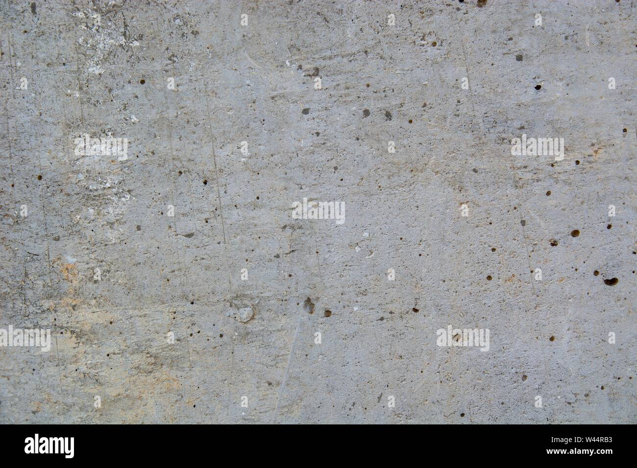 Closeup of a damaged grungy marble wall with small holes Stock Photo ...