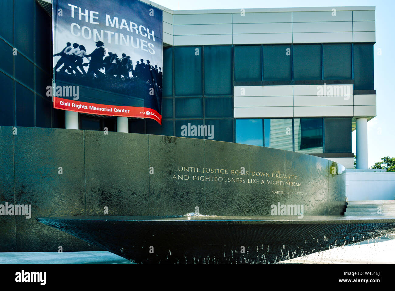A photographic banner depicts African Americans on a protest march in ...