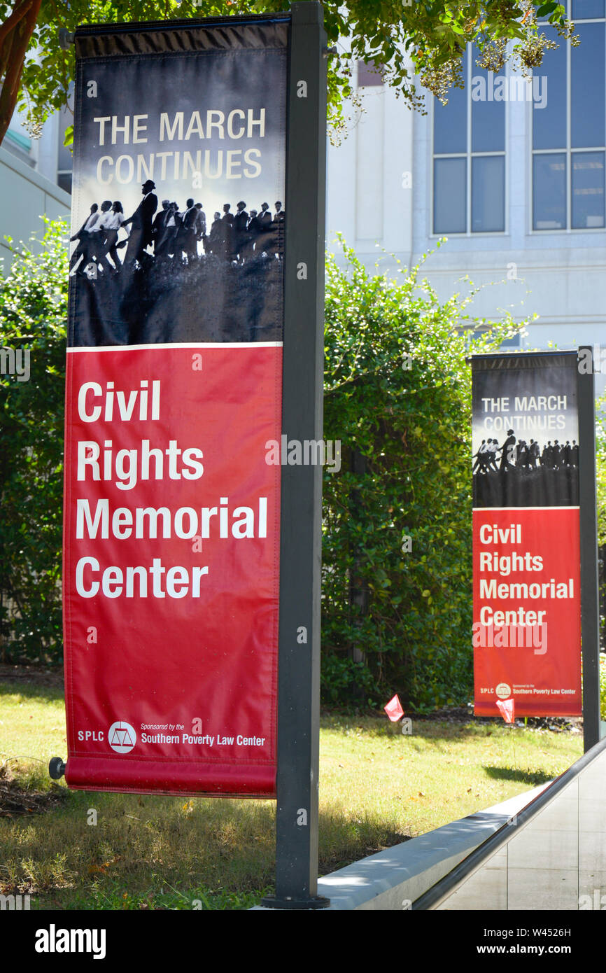 Photographic Banners of "The March Continues" hang along the entrance ...