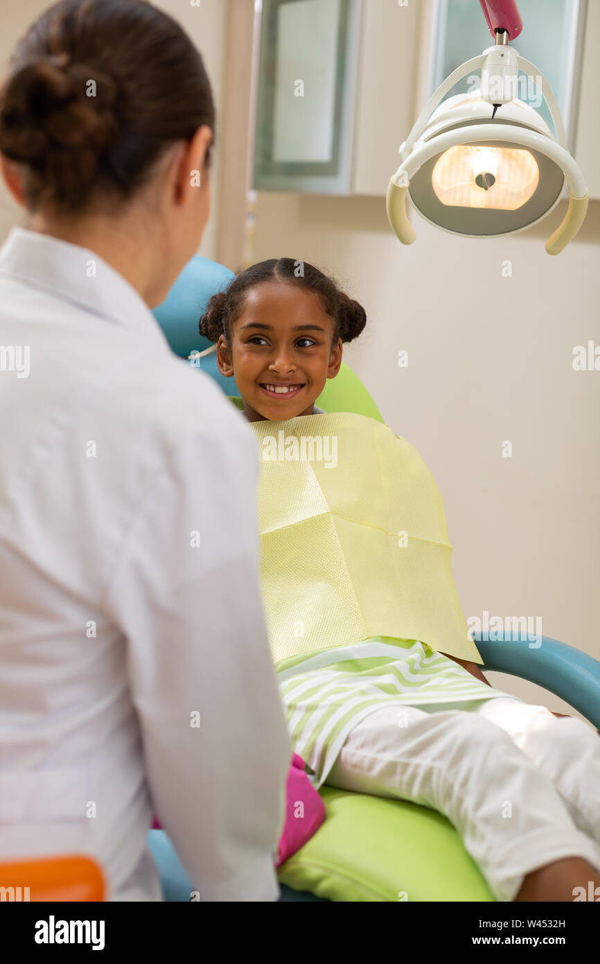Woman doctor talking to a young female patient Stock Photo - Alamy