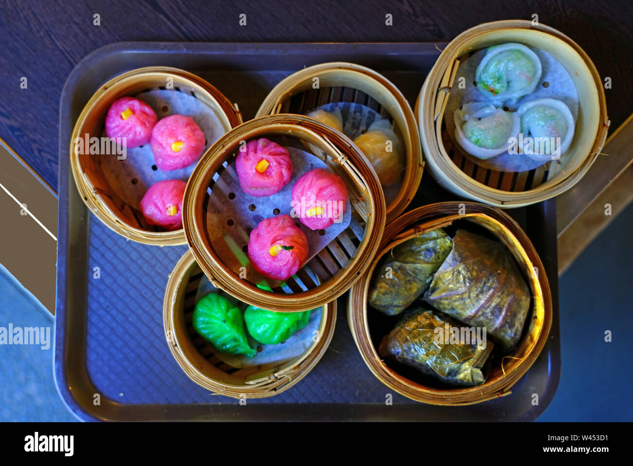 Tray of colorful Dim sum dumplings in a steam basket Stock Photo - Alamy