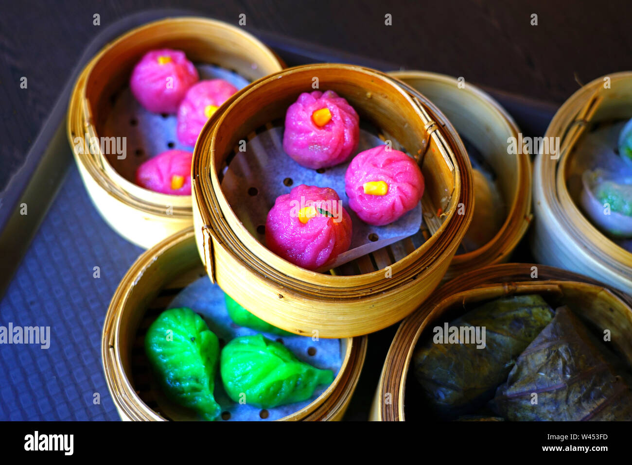 Tray of colorful Dim sum dumplings in a steam basket Stock Photo - Alamy