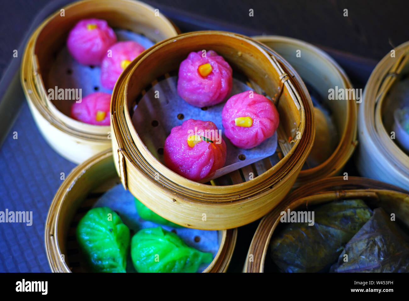 Tray of colorful Dim sum dumplings in a steam basket Stock Photo - Alamy