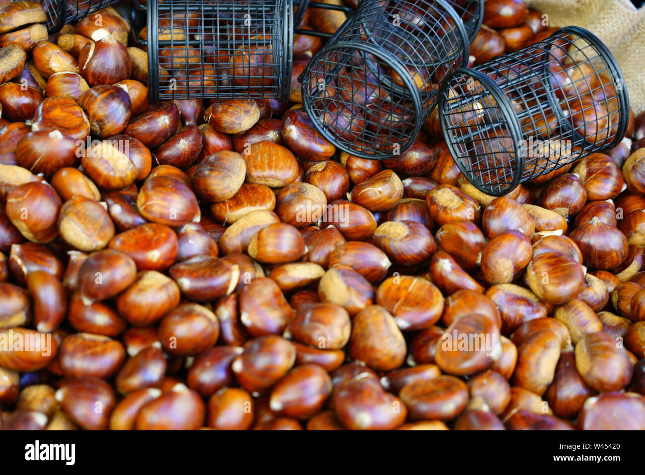 Fresh chestnuts in the shell at a farmers market Stock Photo - Alamy