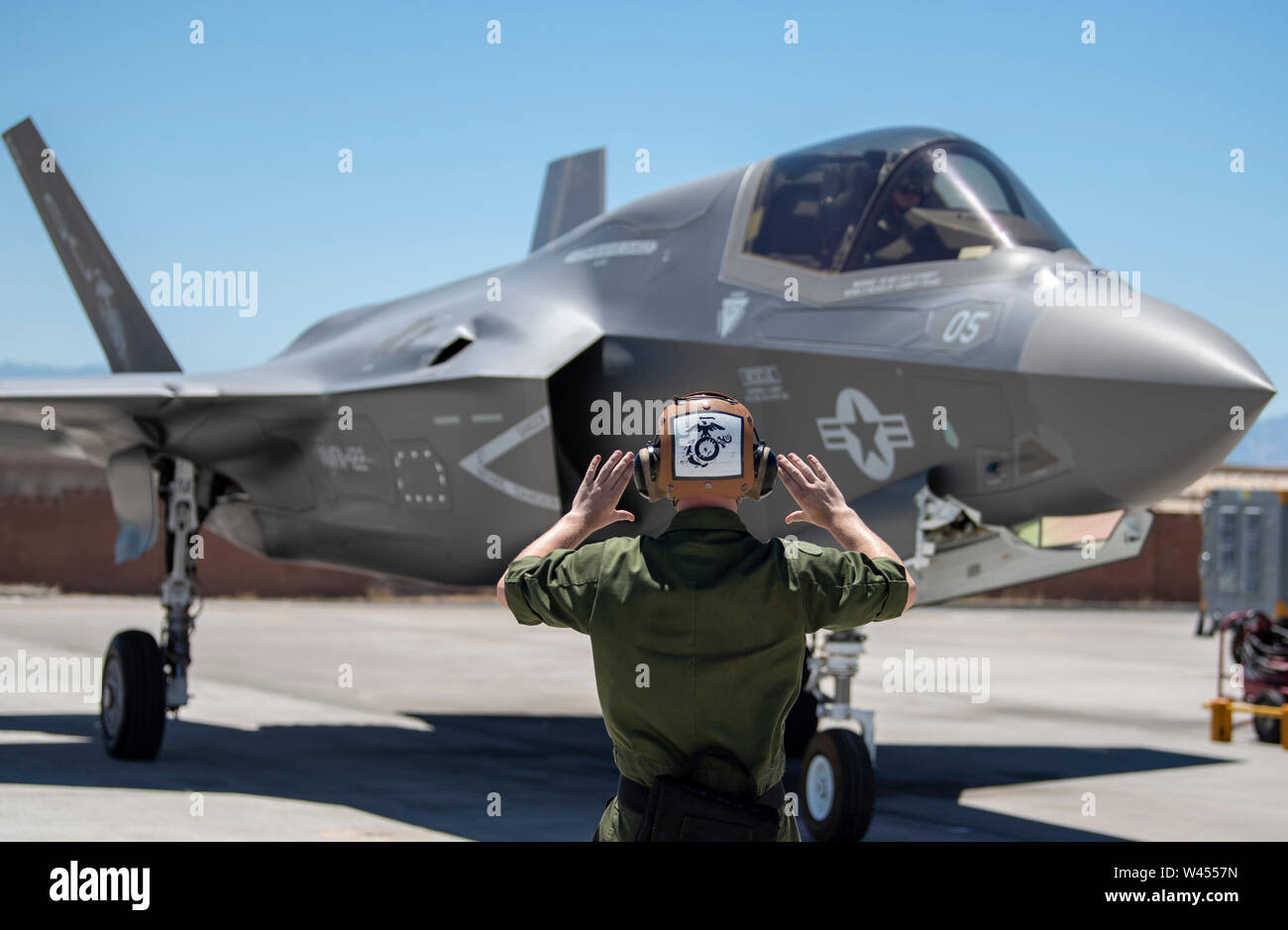 A Marine powerline mechanic assigned to Fighter Attack Squadron 122 ...