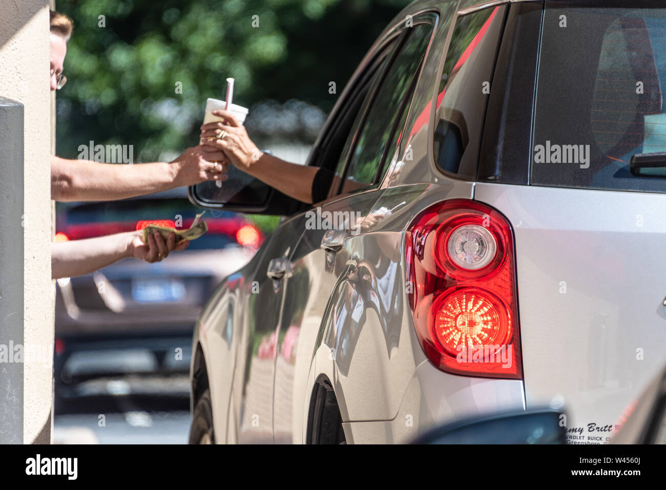 Handing in drive thru hi-res stock photography and images - Alamy