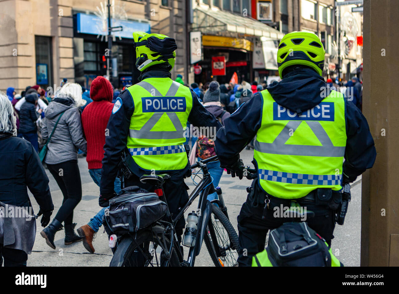 Two on duty police officers wearing high visibility uniforms are seen ...