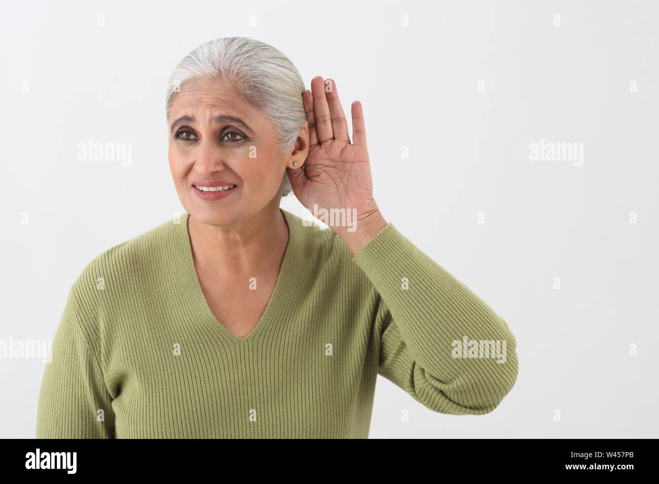 Woman trying to listen Stock Photo - Alamy