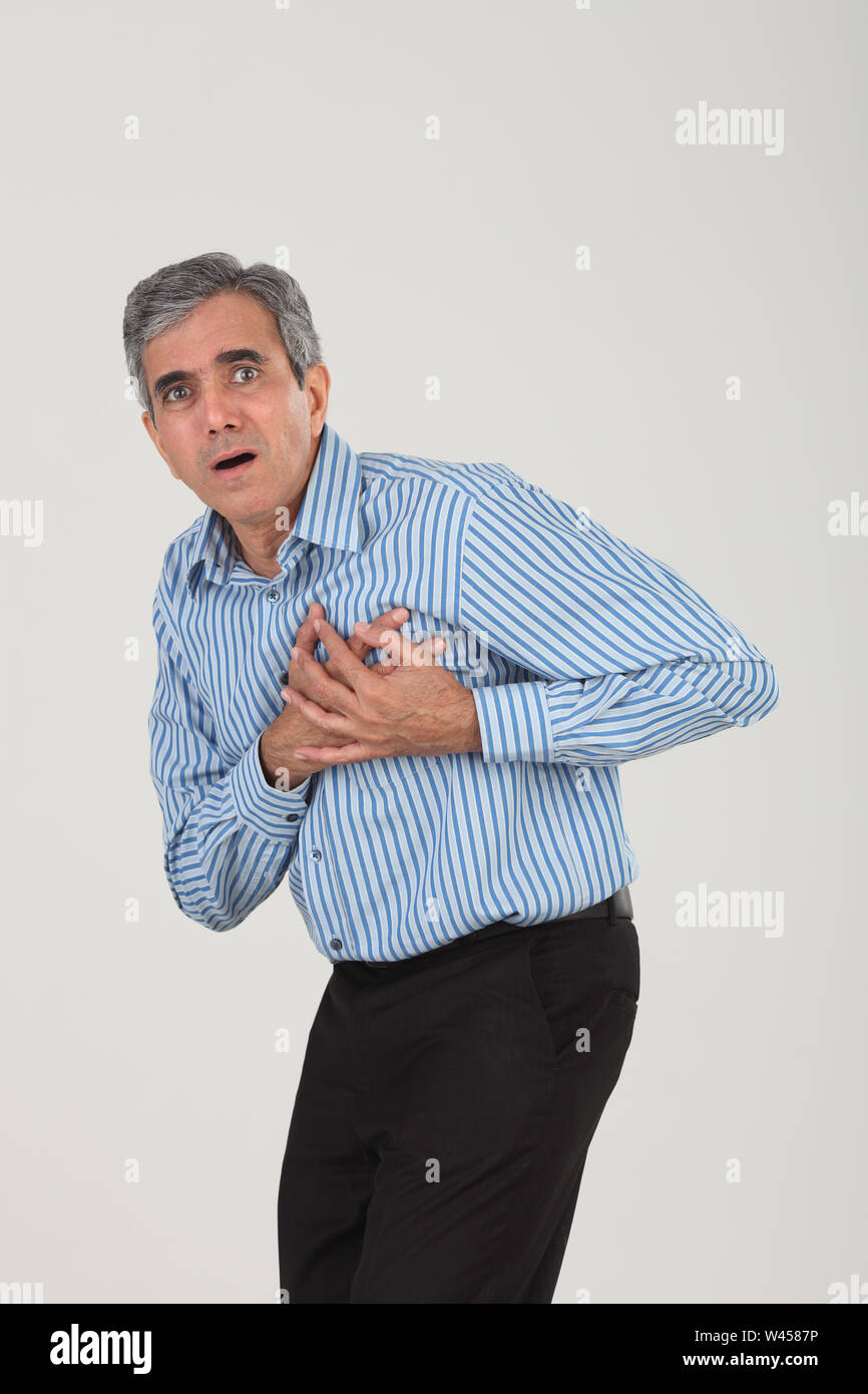 Indian man chest pain hi-res stock photography and images - Alamy