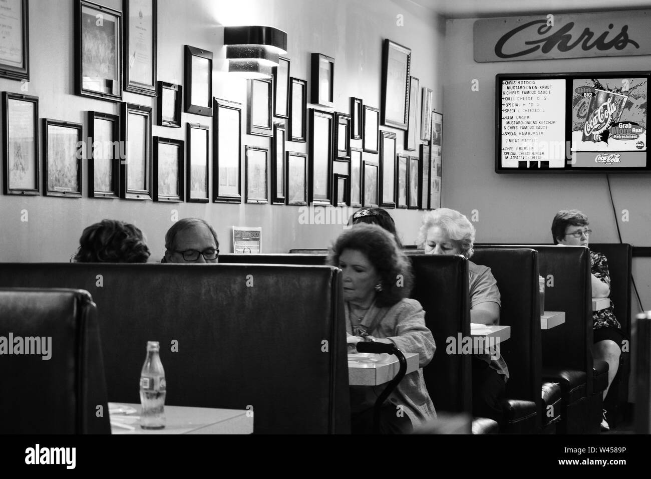 Interior of Chris' Famous Hot Dogs cafe with photos of Hank Williams ...
