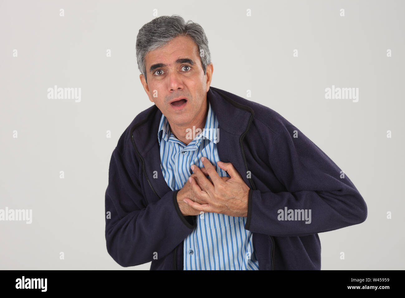 Portrait of a man suffering from chest pain Stock Photo - Alamy