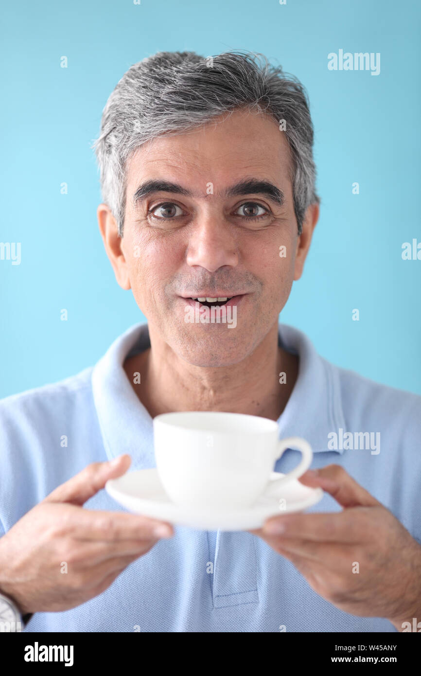 Portrait of a man having tea Stock Photo - Alamy