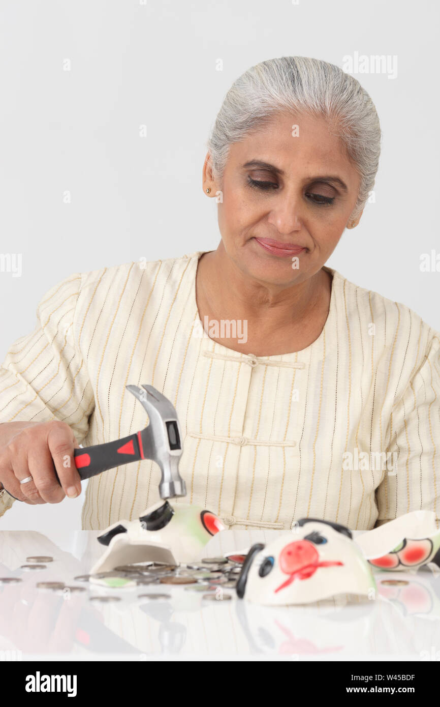 Indian woman holding hammer hi-res stock photography and images - Alamy