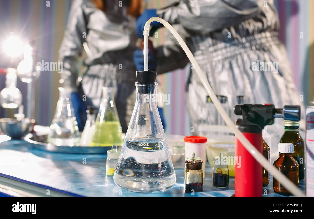 Experiments in a chemistry lab. conducting an experiment in the ...