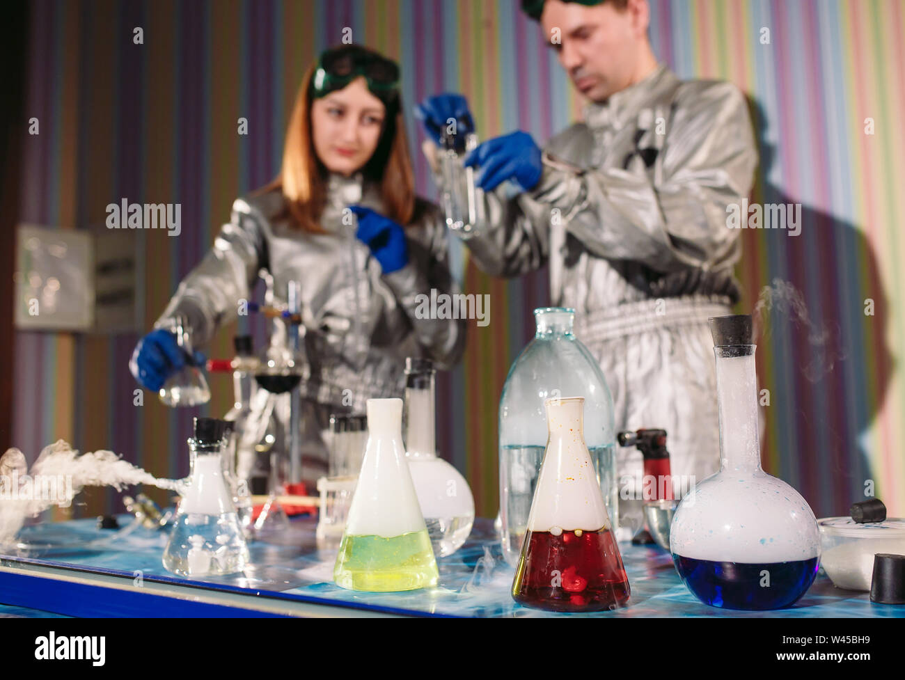 Experiments in a chemistry lab. conducting an experiment in the ...