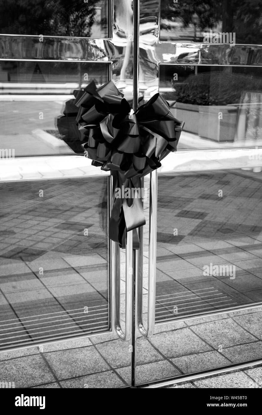 A traditional sign of a death, Big Black Bows of ribbon are tied around ...