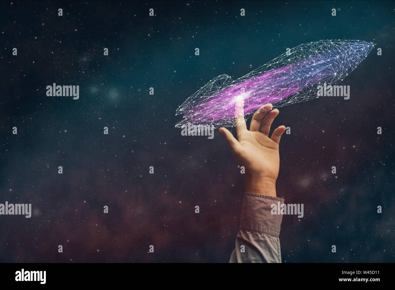 Human forefinger touches spaceship. Nebula dust in infinite space ...