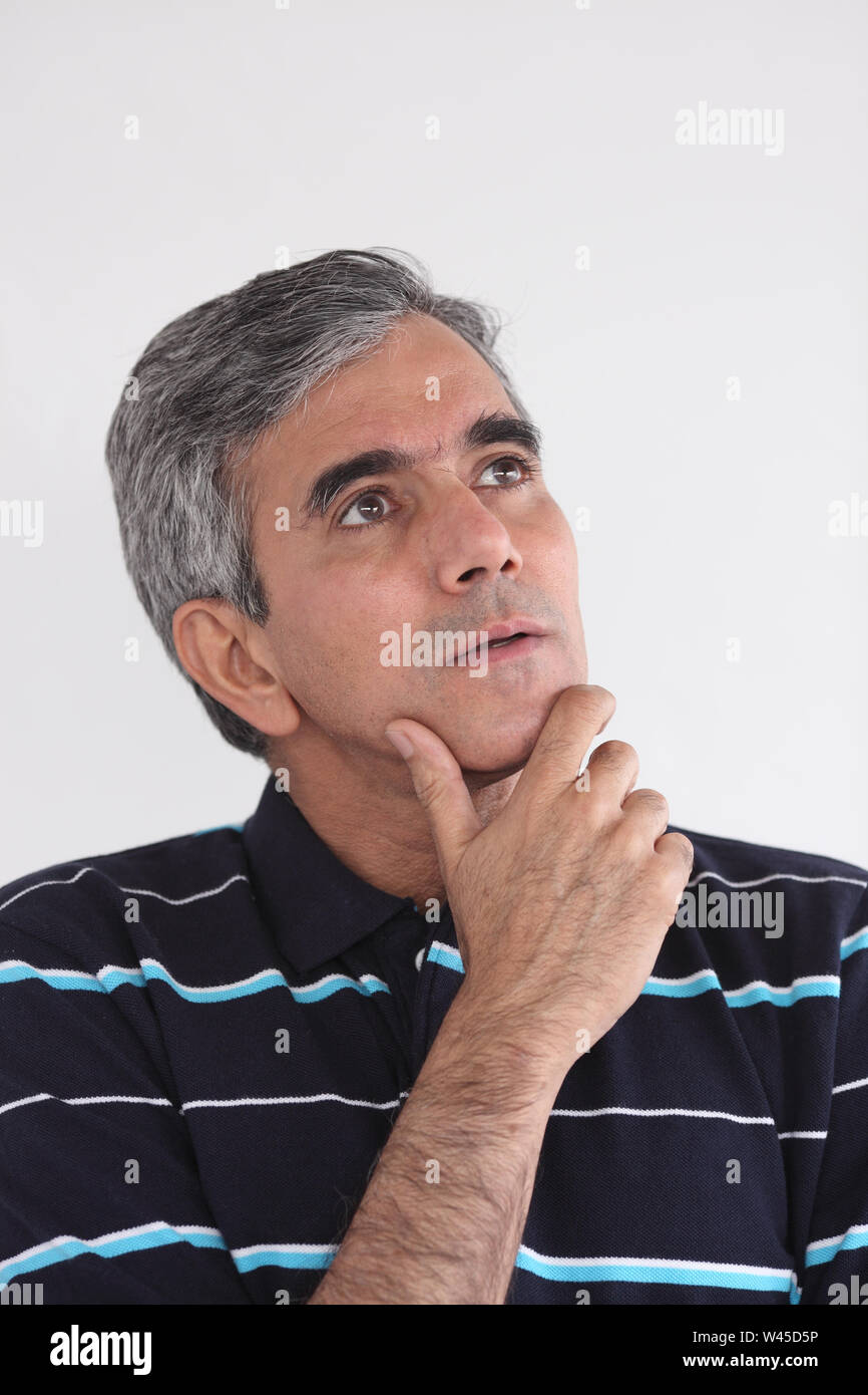 Senior man thinking Stock Photo - Alamy