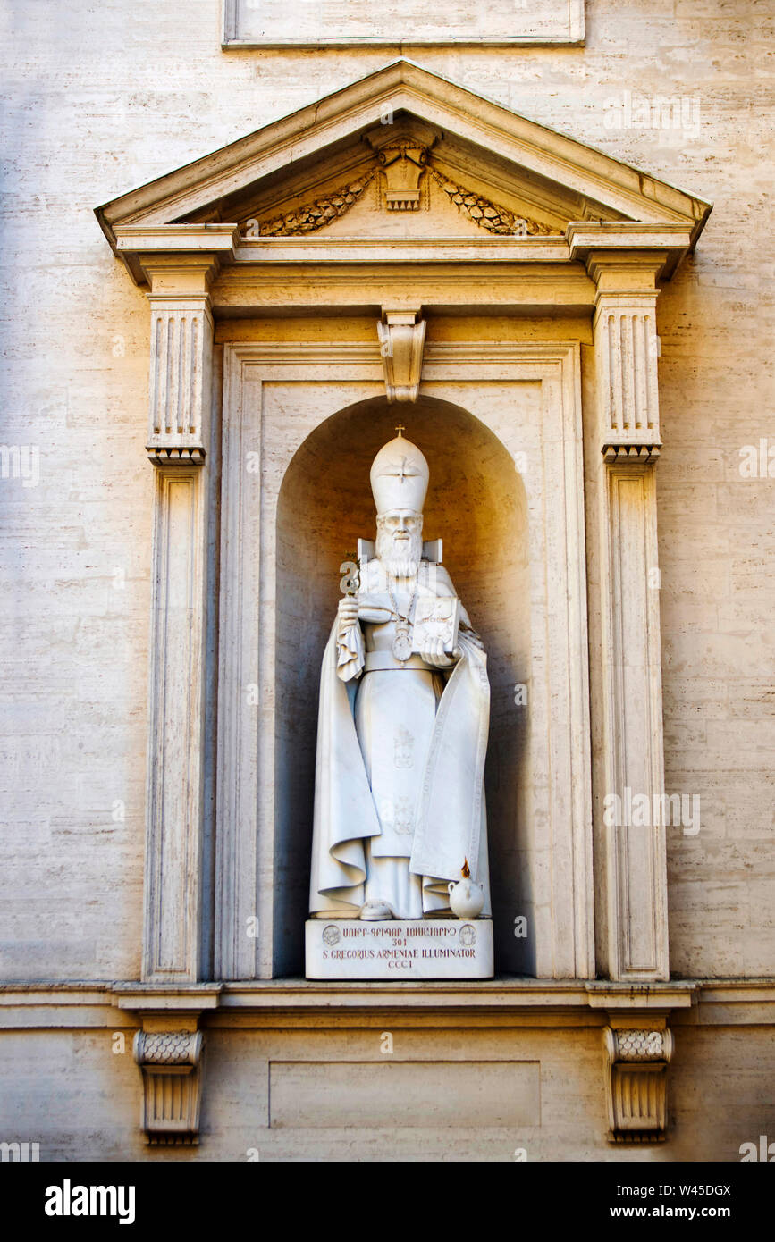 Statue of a Roman priest holding the secret text in his right hand ...
