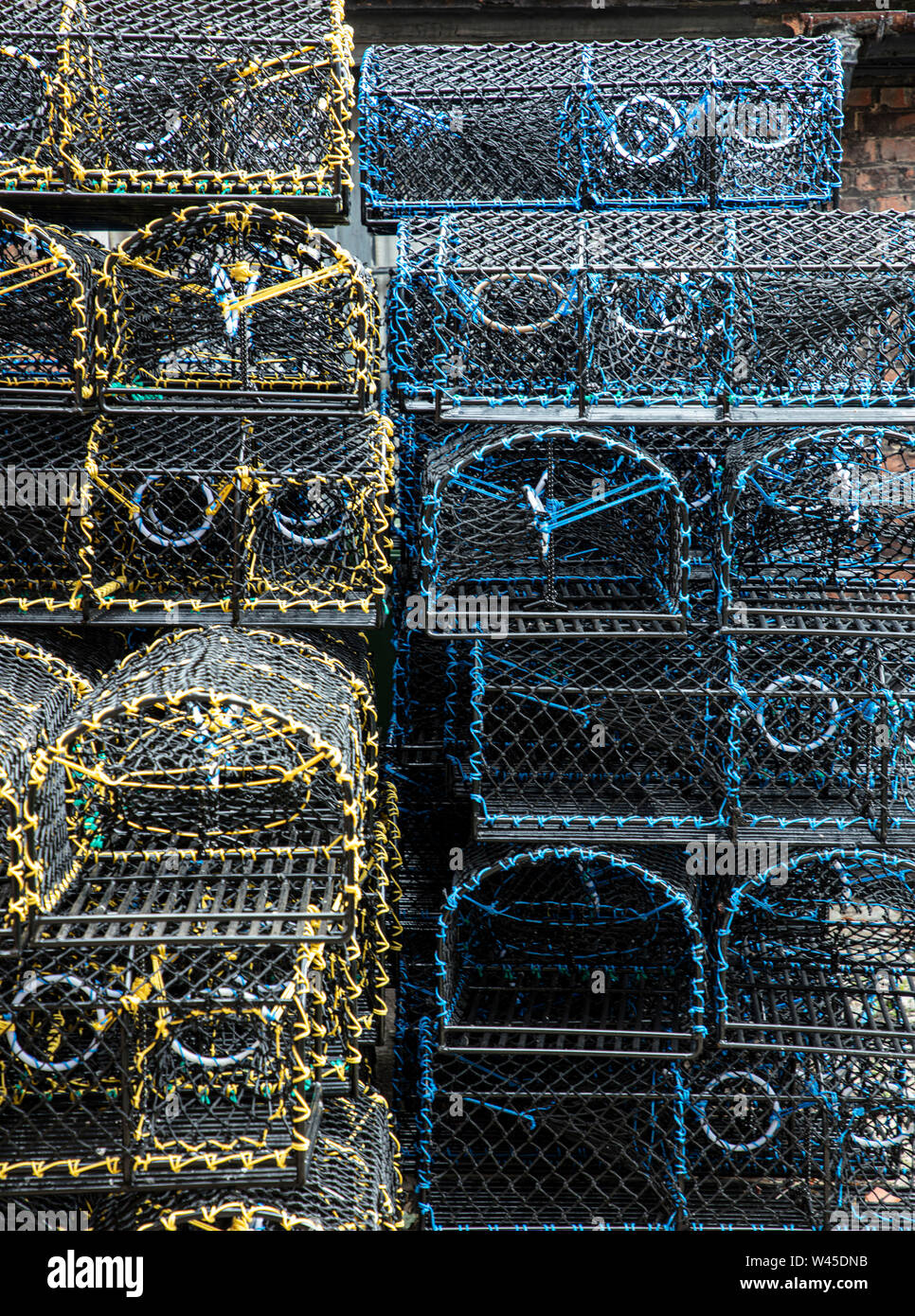 A quayside stack of lobster/seafood pots Stock Photo - Alamy