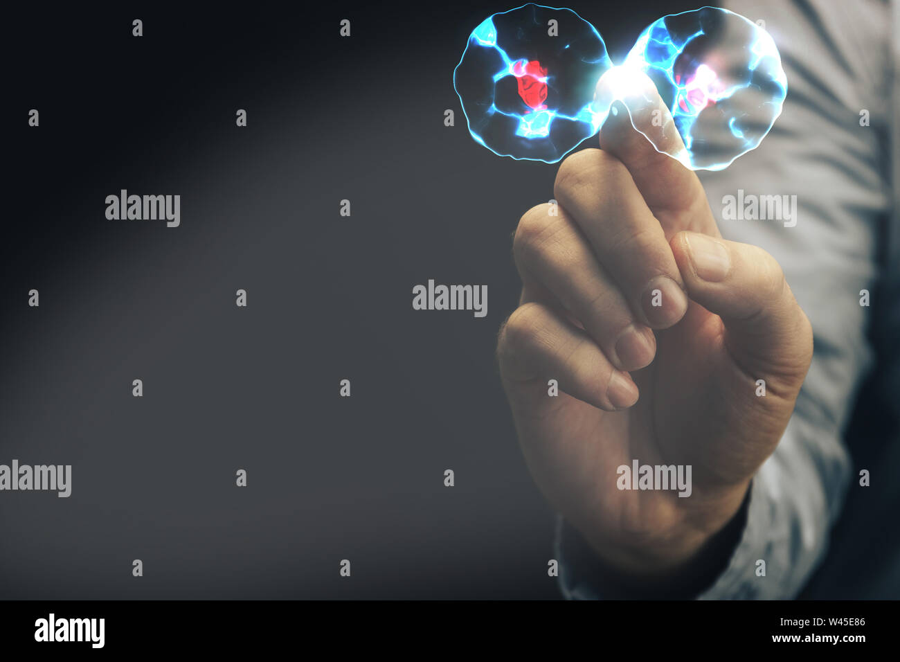 Human forefinger touches cell dividing. Mixed media Stock Photo - Alamy