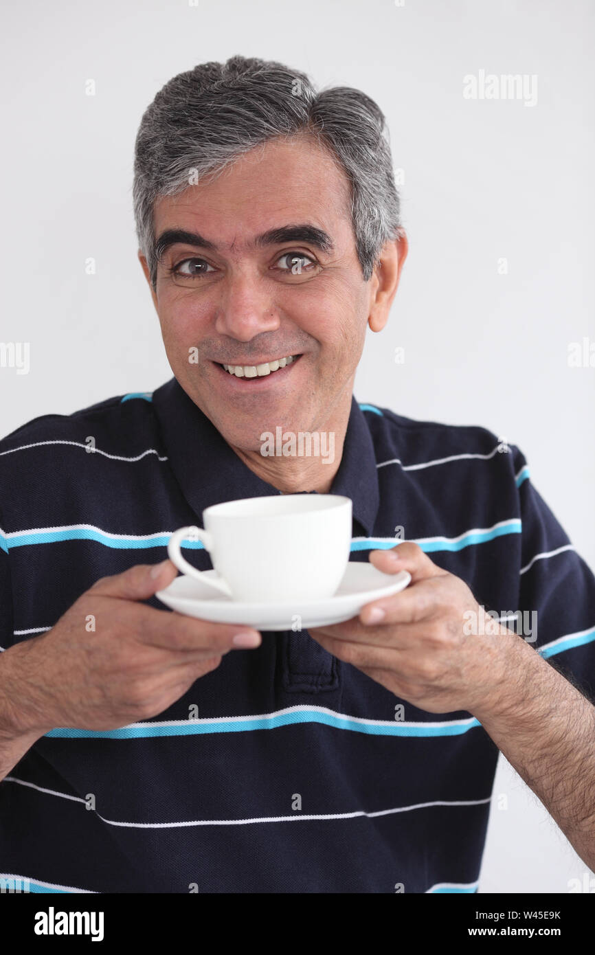 Portrait of a man having tea Stock Photo - Alamy