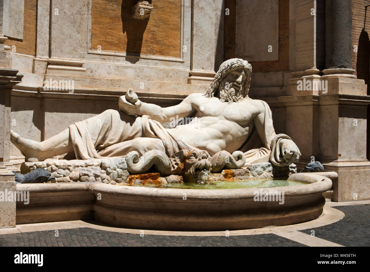 Closer view of a statue of a reclining priest, Capitoline Museum, Rome ...