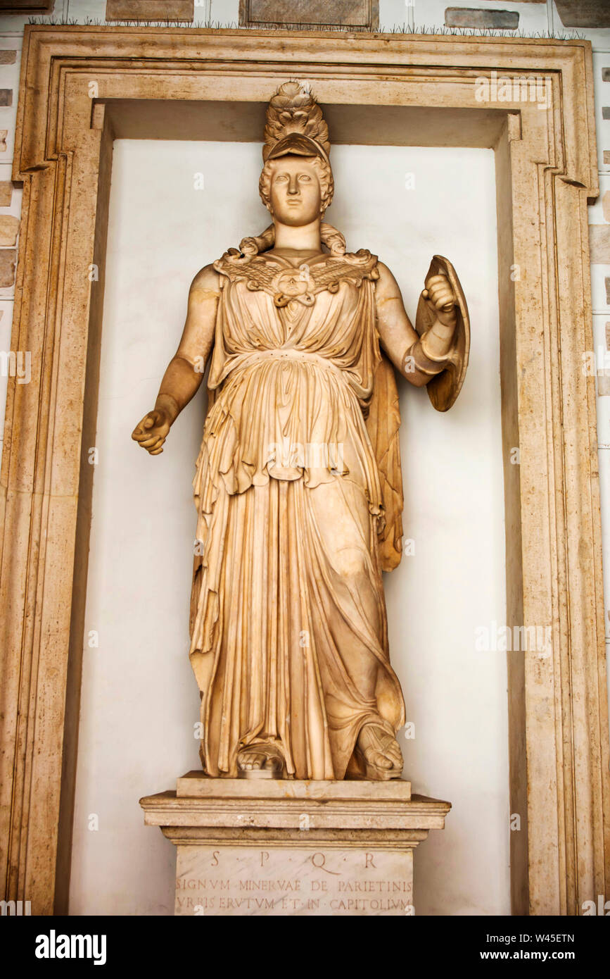 Statue of a female warrior holding a shield in her left hand ...