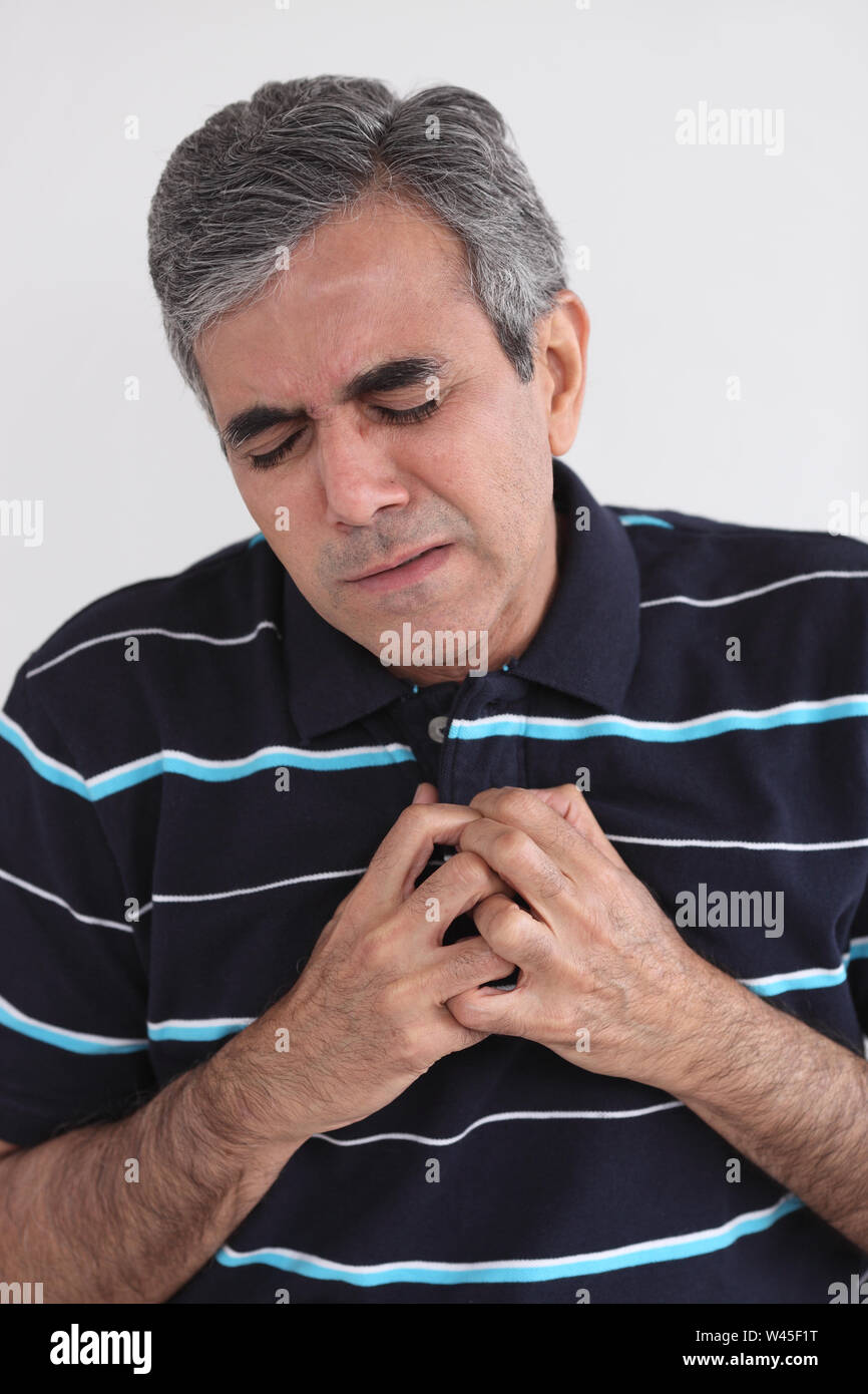 Indian man chest pain hi-res stock photography and images - Alamy