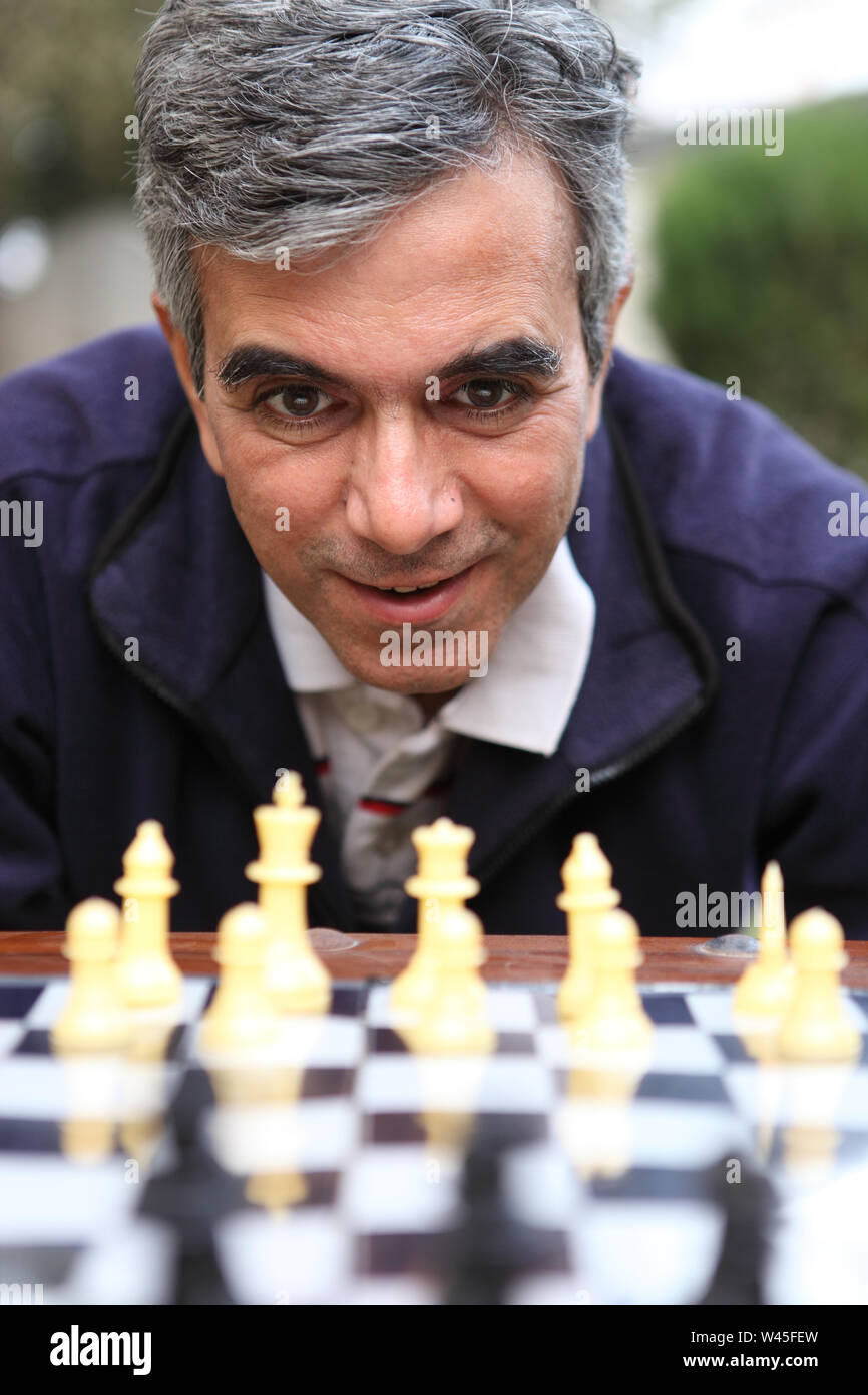 Man playing chess Stock Photo - Alamy