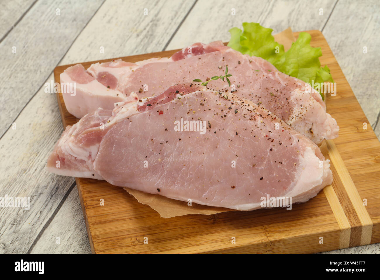 Raw pork meat steak ready for grill Stock Photo - Alamy