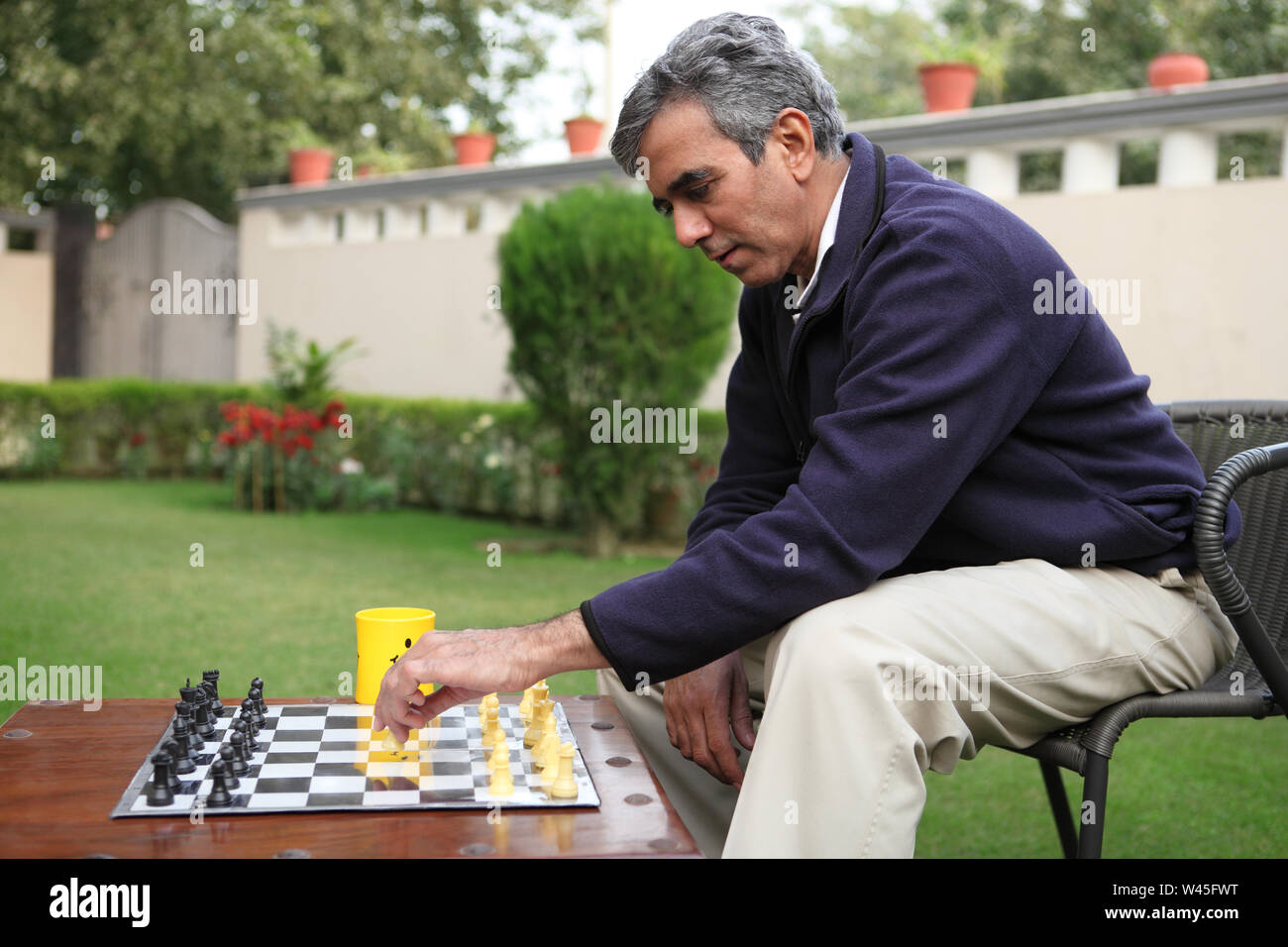 Man playing chess Stock Photo - Alamy