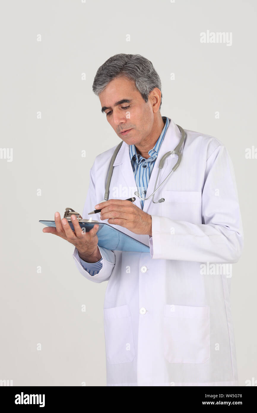Male doctor writing prescription Stock Photo - Alamy