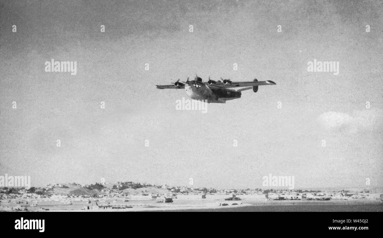 Consolidated PB2Y Coronado in flight over the California seacoast ...