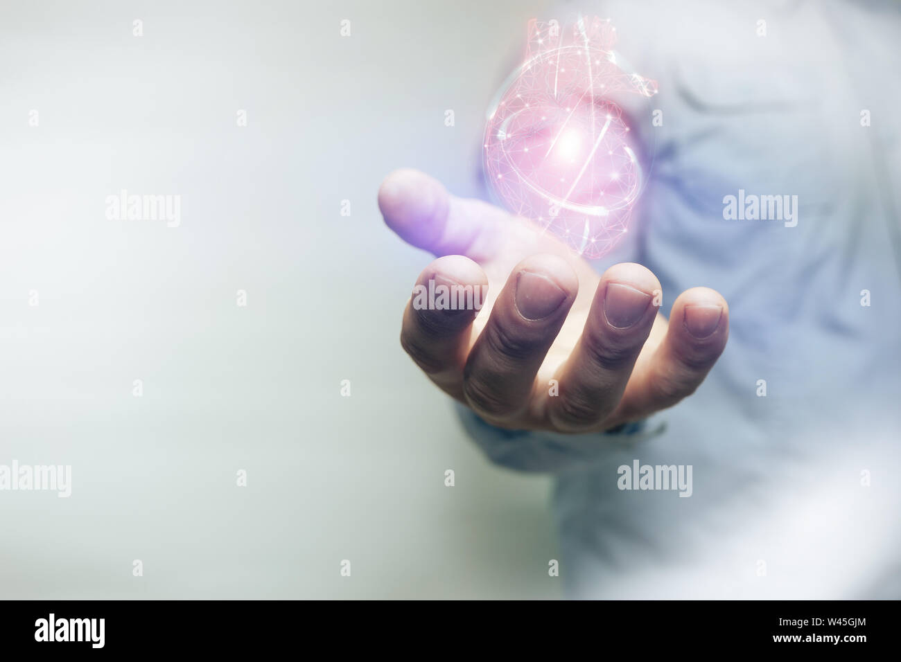 Human forefinger touches red heart innovative technologies on a white ...