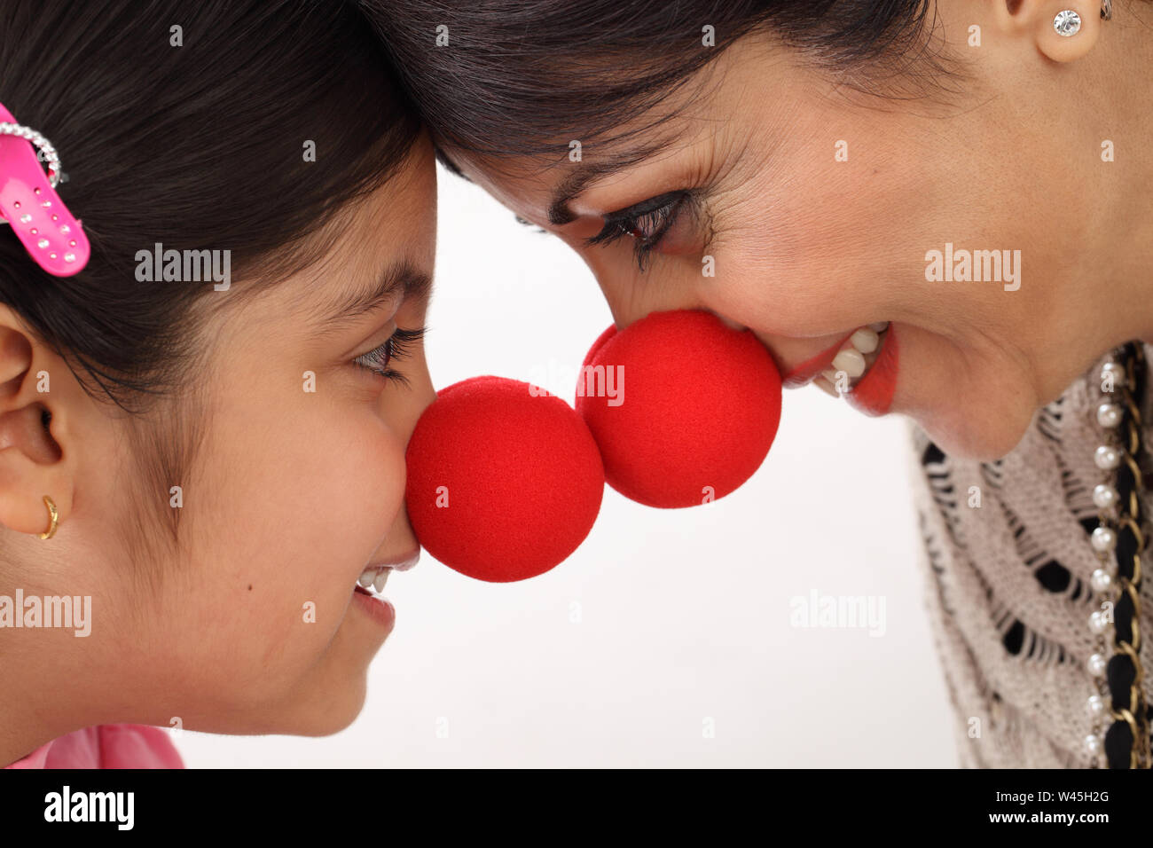 Mother and daughter wearing clown noses Stock Photo - Alamy