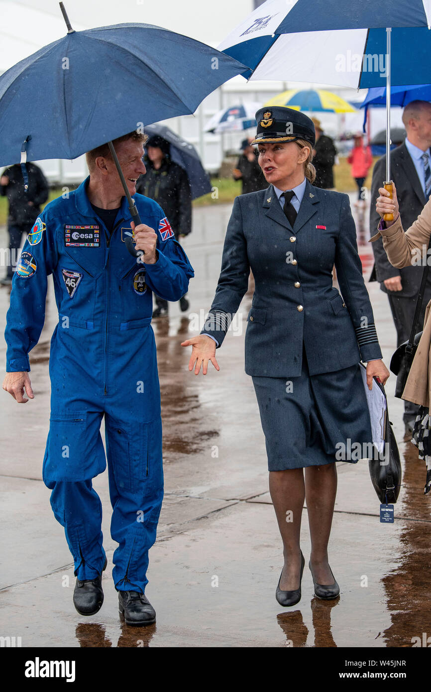Astronaut Tim Peake and Carol Vorderman brave the rain in uniform at ...
