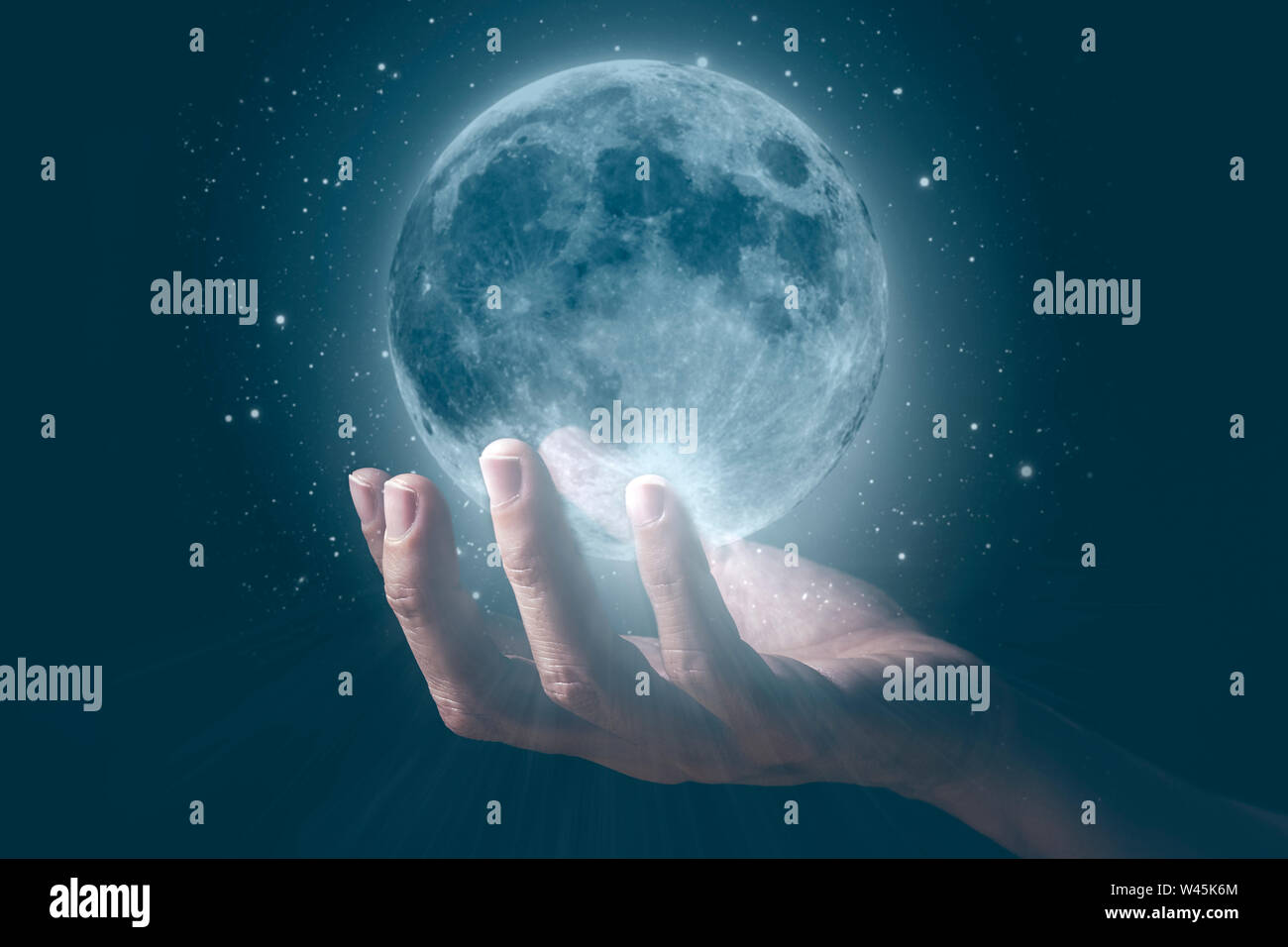 The moon hold by a human hand Stock Photo - Alamy