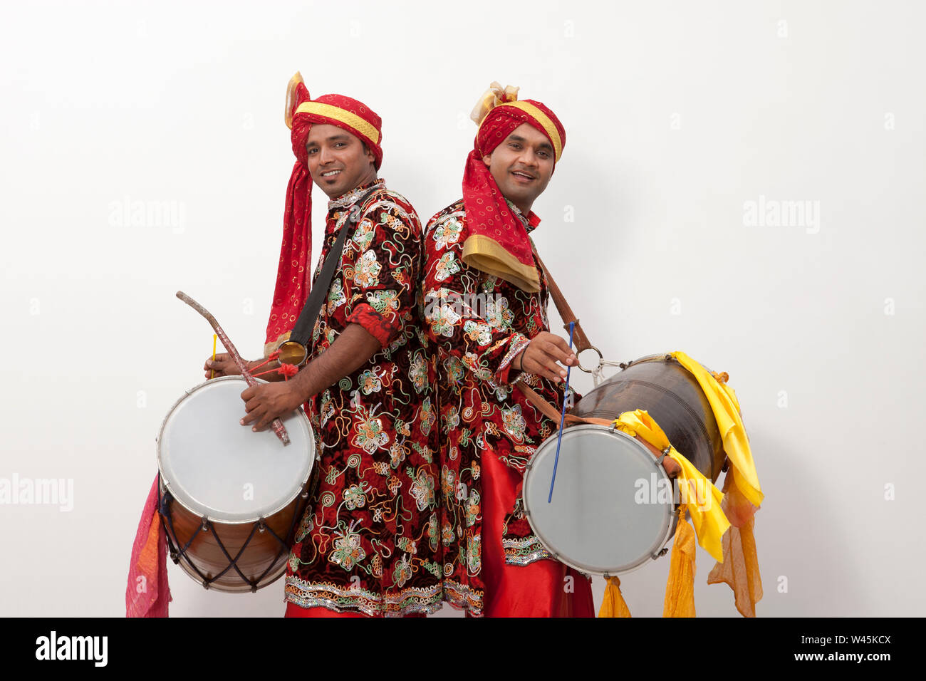 Indian men playing musical instrument hi-res stock photography and ...